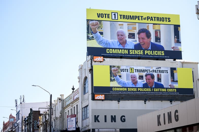 A billboard showing an advertisement for Clive Palmer’s Trumpet of ...